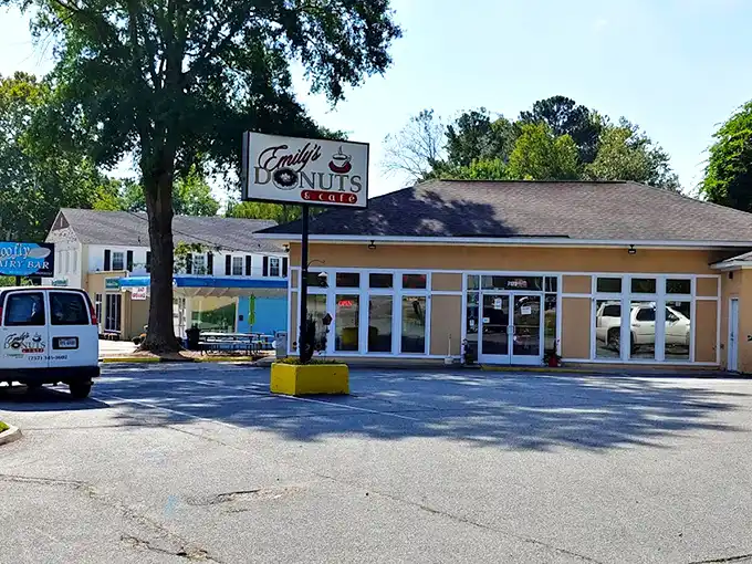 Emily's Donuts & Cafe exterior beckons like a siren song to morning commuters – unassuming strip mall, extraordinary donuts.