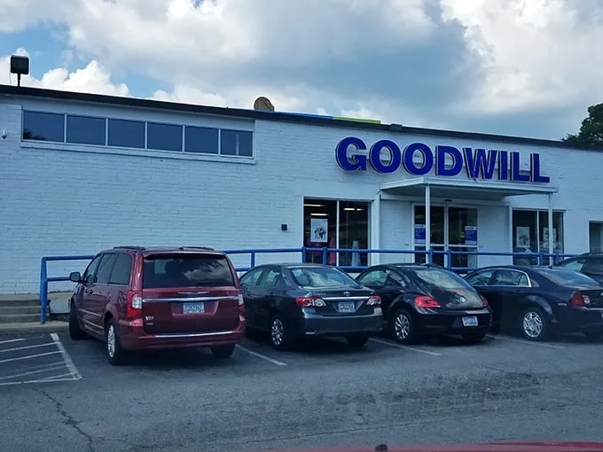 The blue Goodwill sign beckons like a lighthouse for bargain hunters – a treasure chest where yesterday's splurges become today's steals.