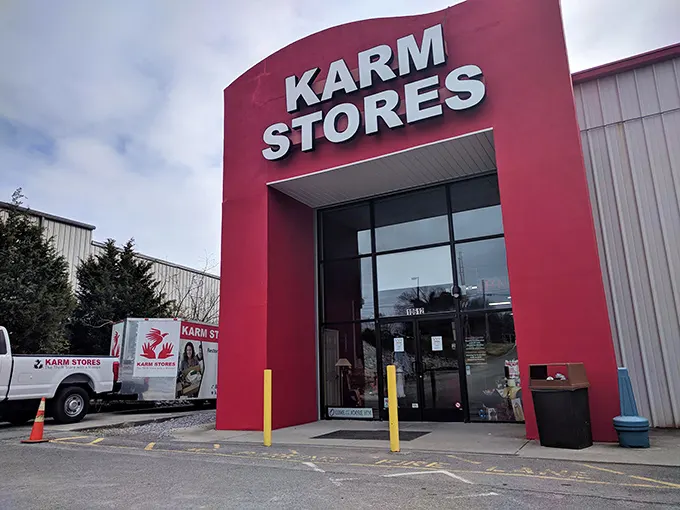KARM Stores: That bold red entrance isn't just eye-catching—it's like a siren call to bargain hunters everywhere!