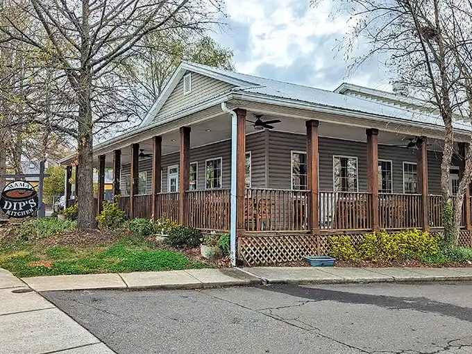 Mama Dip's welcomes you with its charming wooden porch – like stepping onto your favorite aunt's front steps before Sunday dinner.