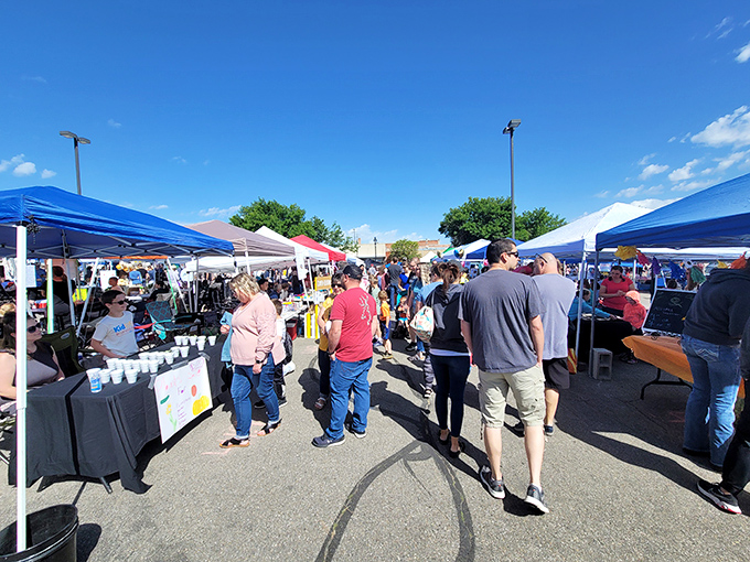 Shoppers navigate a sea of blue canopies, where every corner of this Nampa market promises discoveries worth bragging about at your next family dinner.