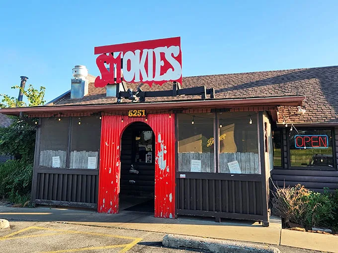 Smokies' bright red doors aren't just for show—they're portals to a hickory-scented paradise where calories don't count.