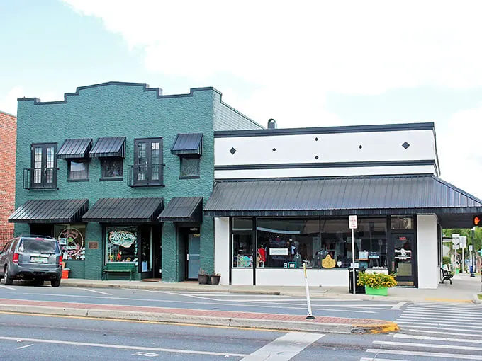 These mint-green awnings aren't just pretty—they're time machines to when downtown shopping didn't require a mall map.