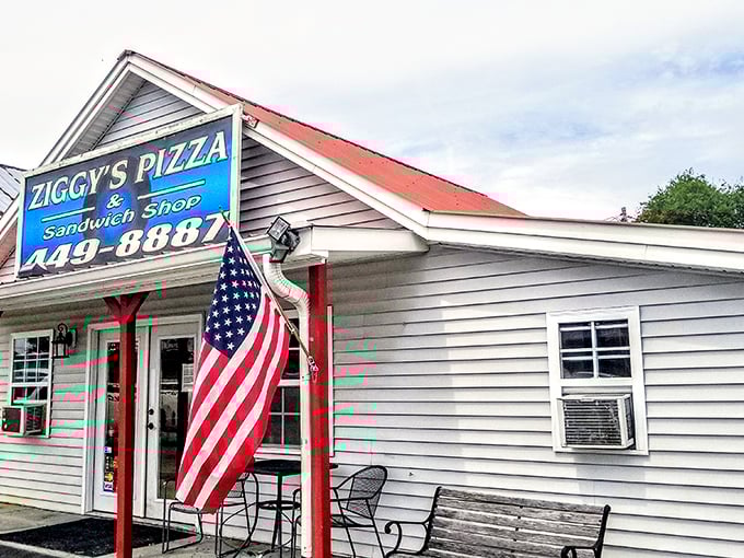 That American flag and cheerful yellow sign aren't just decoration – they're Ziggy's way of saying "welcome home" to pizza lovers.