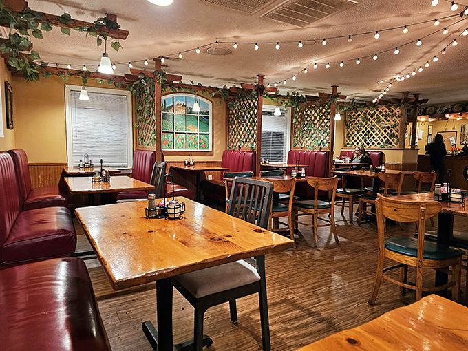 Red booths, wooden tables, and string lights create that magical Italian restaurant atmosphere where calories don't count and conversations flow like wine.