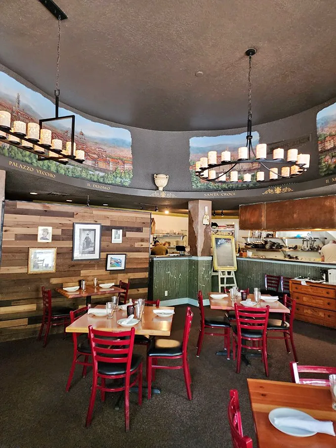 The dining room's warm wooden walls, Italian murals, and glowing chandeliers transport you straight to Tuscany without the jet lag.