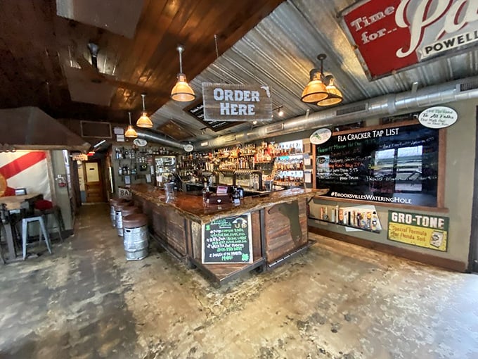 The bar area strikes that perfect balance between rustic charm and functional watering hole. That "Order Here" sign isn't kidding around—good things await.