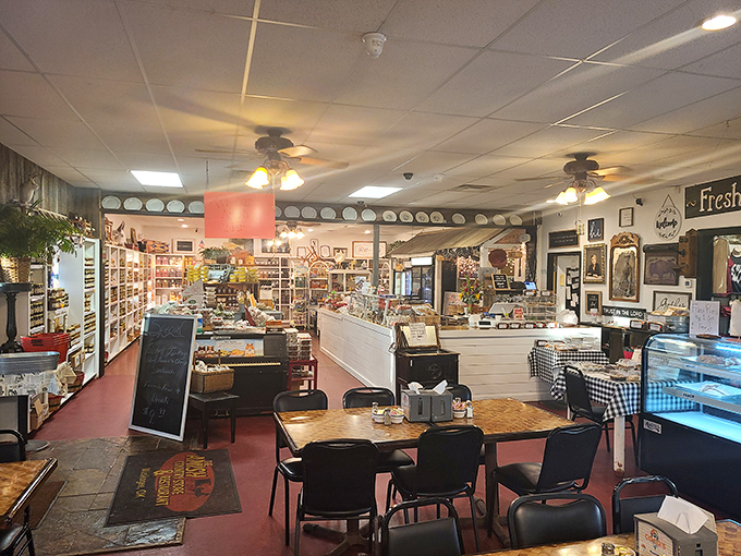 Inside, country charm meets culinary purpose – shelves of artisanal goods flank cozy dining tables where food memories are made daily.