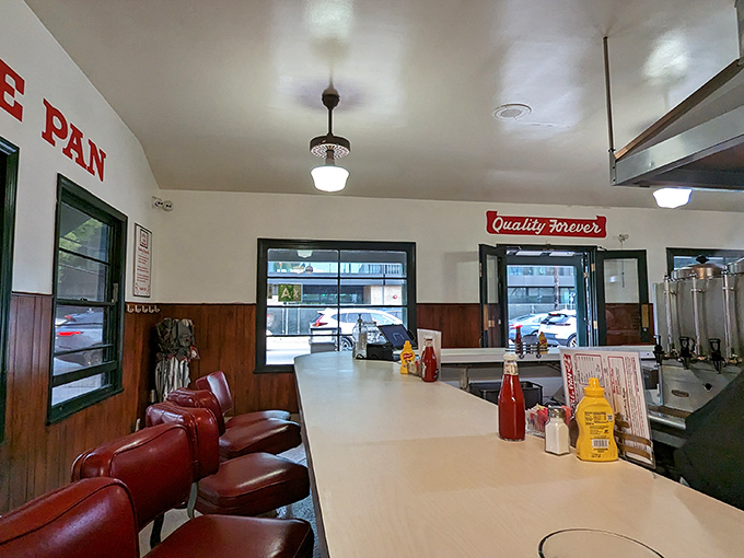 Step inside and you're transported to mid-century America – red vinyl stools, formica countertops, and not a smartphone charging station in sight. Pure analog dining perfection.