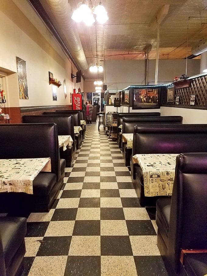 Classic black and white checkered floors lead you down the path to burger enlightenment. The booths aren't just seating—they're front-row tickets to flavor town.