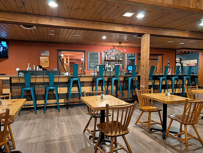 Rustic wooden beams frame a dining room that feels like a secret clubhouse for carnivores. The "FARM" sign isn't decoration—it's a mission statement. 
