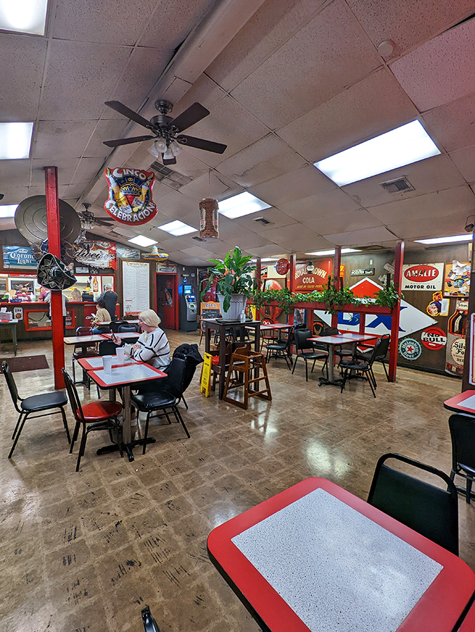 Inside Tacoville, vintage signs and simple decor create an atmosphere that says, "We're here for the food, not the frills."