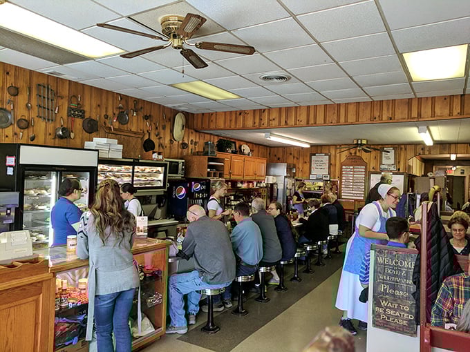 Where magic happens! The wood-paneled interior buzzes with conversation while servers navigate the packed counter with the precision of Olympic athletes.