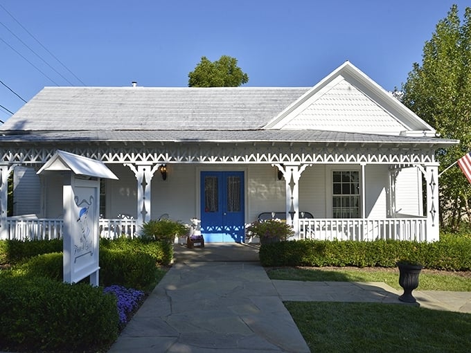 The French Goat's pristine white cottage with blue accents offers a slice of Provence in Appalachia, complete with garden seating.