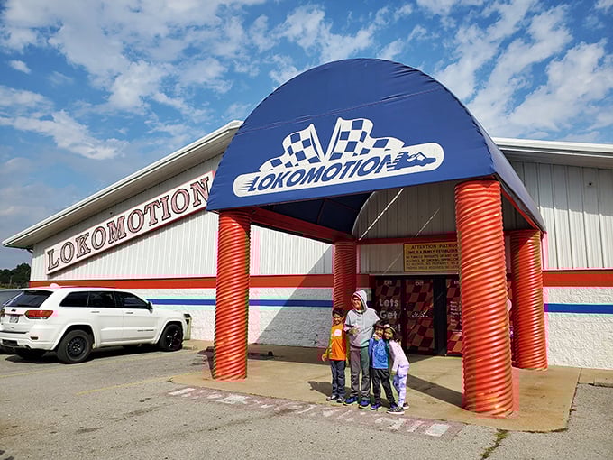 The entrance says it all—this isn't just a place, it's a destination. Those red columns stand like the gates to a childhood you thought was long gone.