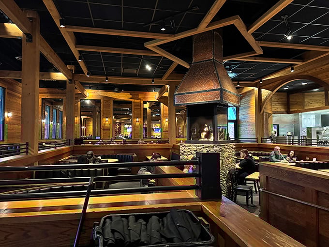 Exposed wooden beams and that signature copper hood create an atmosphere that's both upscale and unpretentious—like a ski lodge that decided to major in comfort food.