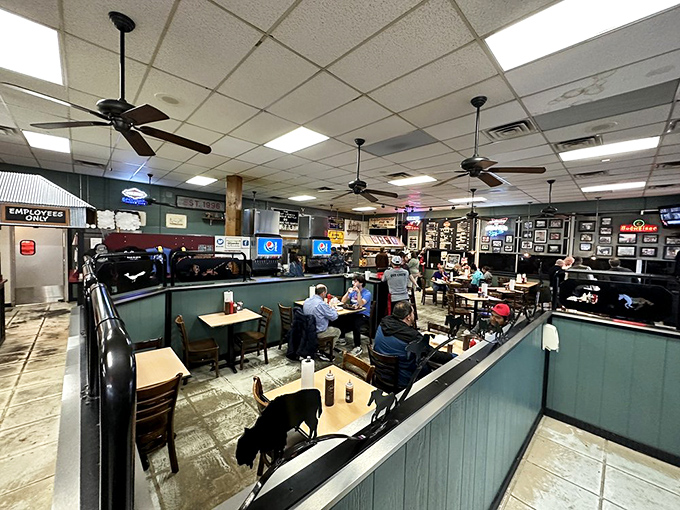 Inside, ceiling fans circulate the intoxicating aroma of smoked meats while diners commune in barbecue bliss. No white tablecloths needed when the food speaks this eloquently.
