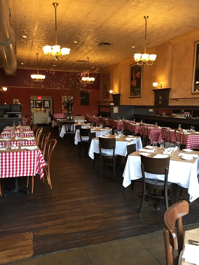 Red-and-white checkered tablecloths, warm lighting, and classic French posters transport you straight to Paris without the jet lag or passport control.