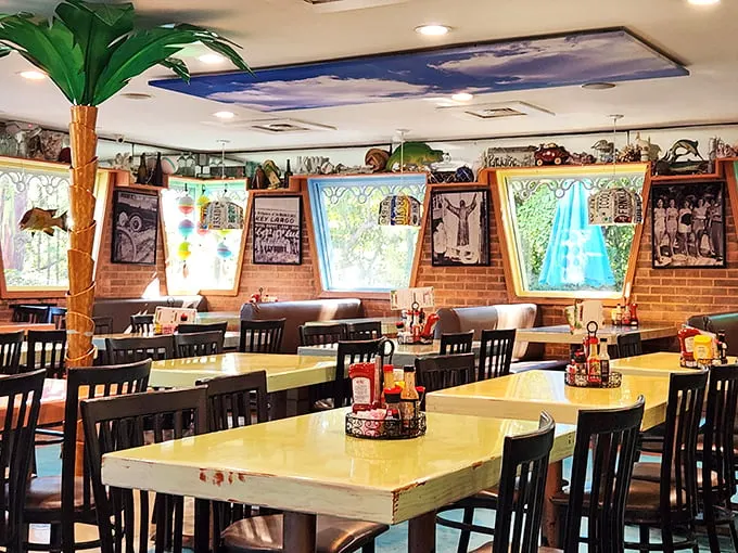 Tropical paradise meets family dining room—complete with the obligatory palm tree. Because nothing says "Florida Keys" like indoor foliage and fishing memorabilia.