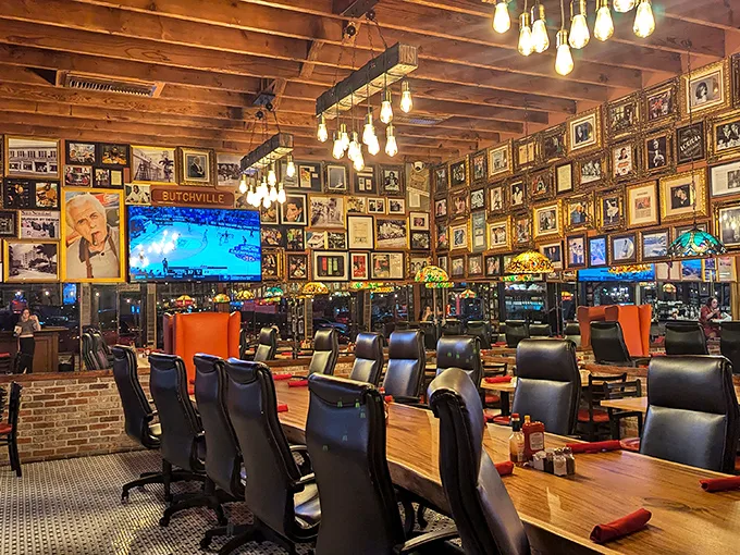 Wall-to-wall memories create a living museum where every framed photo tells a story, and every Edison bulb illuminates decades of dining history.