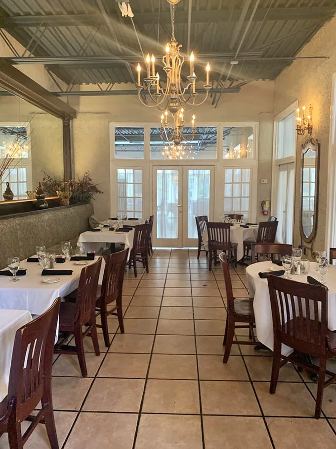 Elegant chandeliers cast a warm glow over crisp white tablecloths. This isn't just dining—it's dinner and a show where the food plays the starring role.