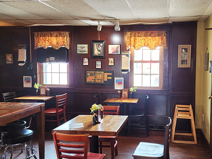 Simple wooden tables, floral curtains, and walls adorned with memorabilia—this isn't interior design, it's barbecue authenticity in its natural habitat.