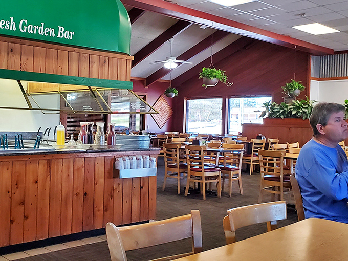Wooden beams, hanging plants, and that unmistakable "Fresh Garden Bar" sign – the interior practically whispers, "Stay awhile, there's plenty more where that came from."
