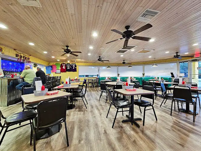 Inside, wooden-paneled ceilings and turquoise booths create that perfect coastal diner vibe – comfortable enough to linger, tempting enough to return tomorrow.