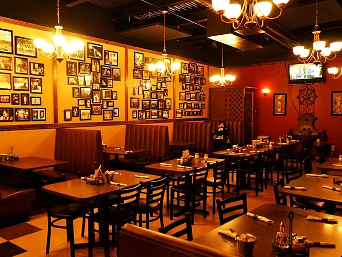 Family memories line the walls like a visual cookbook, creating an atmosphere where every dinner feels like Sunday at nonna's house.