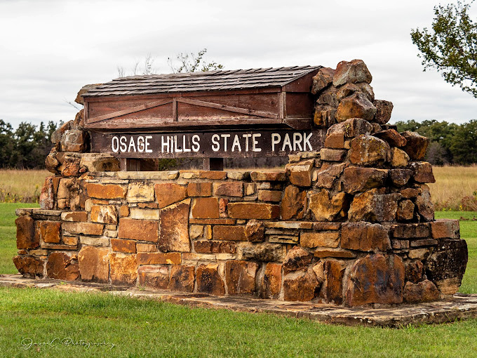 This isn't just a park entrance—it's a time portal crafted by the CCC, where sandstone and timber have welcomed visitors for generations.
