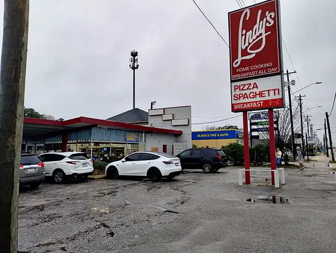 That classic red sign beckons hungry travelers like a lighthouse for breakfast-all-day enthusiasts.