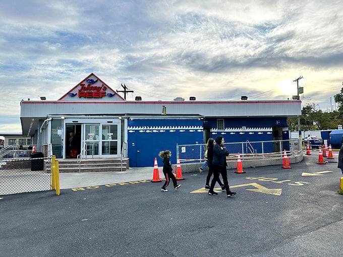 "Oysters, Clam Chowder, Shrimp, Clams" – the sign reads like poetry to seafood lovers and a siren call to the hungry.