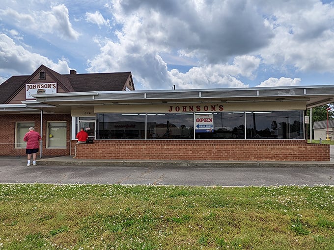That classic brick façade hides burger magic that's been perfected over seven decades of griddle wisdom.