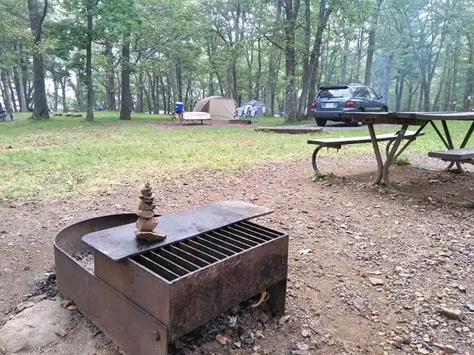 Rustic perfection with a side of serenity. That stacked stone cairn on the fire ring is someone silently saying, "I was here, and it was magnificent."