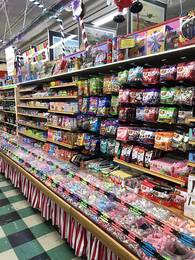 A candy lover's fever dream come true. Those red and white striped bins aren't just containers—they're portals to your childhood sweet tooth. 