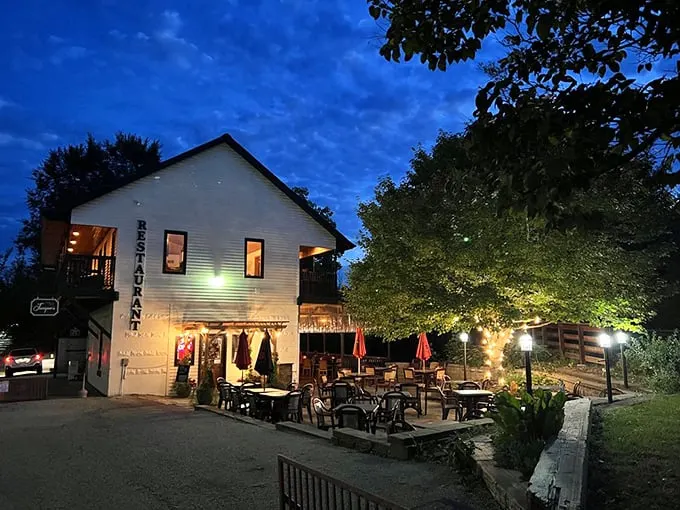 As twilight descends, Juniper's Restaurant transforms into a magical dining destination where the patio's twinkling lights rival the emerging stars above.