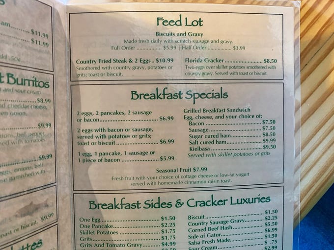 A menu that speaks the universal language of comfort food. Notice that "Side of Gator" casually listed among breakfast sides—pure Florida.