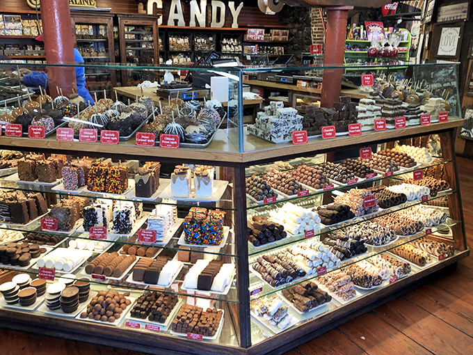 This isn't just a display case—it's an edible art gallery where pralines, fudge, and chocolate-dipped everything compete for your attention and willpower.