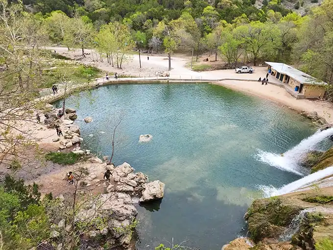 The view from above reveals Turner Falls' secret—a perfect swimming hole that Mother Nature spent millions of years designing.