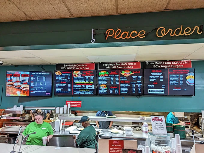 The menu board tells the delicious truth: scratch-made buns, 100% Angus beef, and a toppings bar that makes decision-making gloriously complicated.