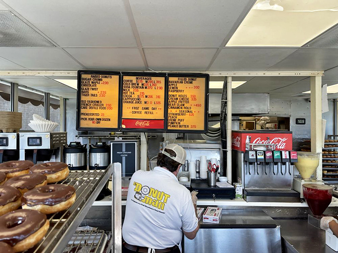 The menu board tells a story of donut dreams, with seasonal specialties that inspire pilgrimages from across Southern California.