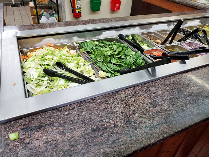 Crisp lettuce, vibrant spinach, and all the fixings – this salad bar is the opening act that somehow manages to steal part of the show.