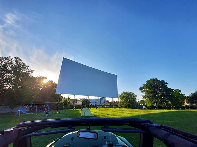 That massive white screen against the blue sky isn't just a movie canvas—it's 120 feet of possibility waiting for darkness to work its magic.