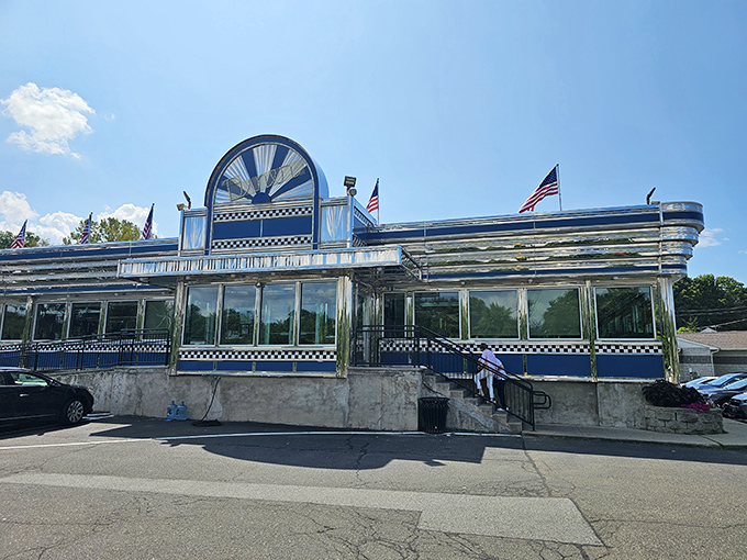 That classic blue and silver exterior with checkered trim says "we take our comfort food seriously" before you even walk in.