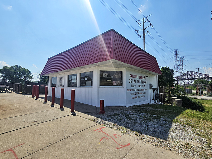Calumet Fisheries stands like a seafood sentinel under the bright blue sky, beckoning with smoky promises.
