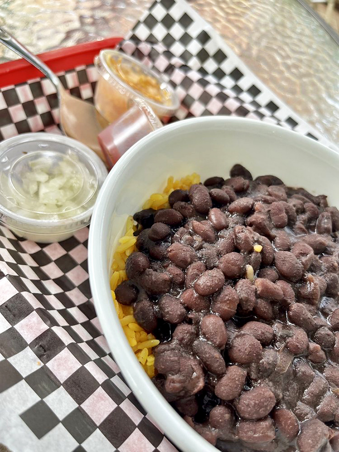 Black beans over yellow rice—Florida's comfort food answer to chicken soup. Simple, hearty, and exactly what you need after antiquing all morning.