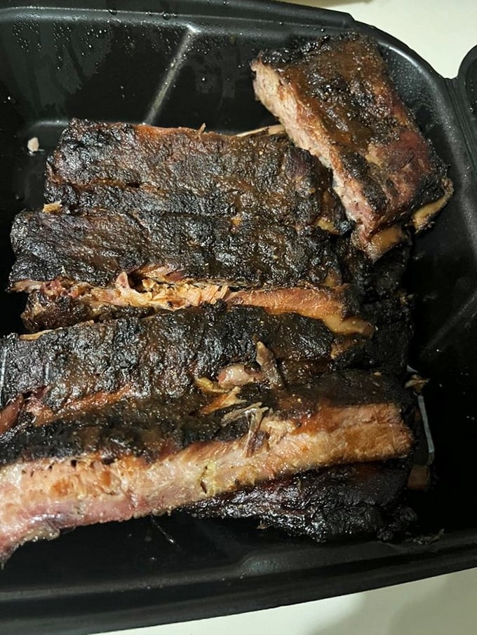 Behold the beef ribs—nature's way of saying "I love you." That bark, that smoke ring, that glistening perfection makes vegetarians question their life choices.