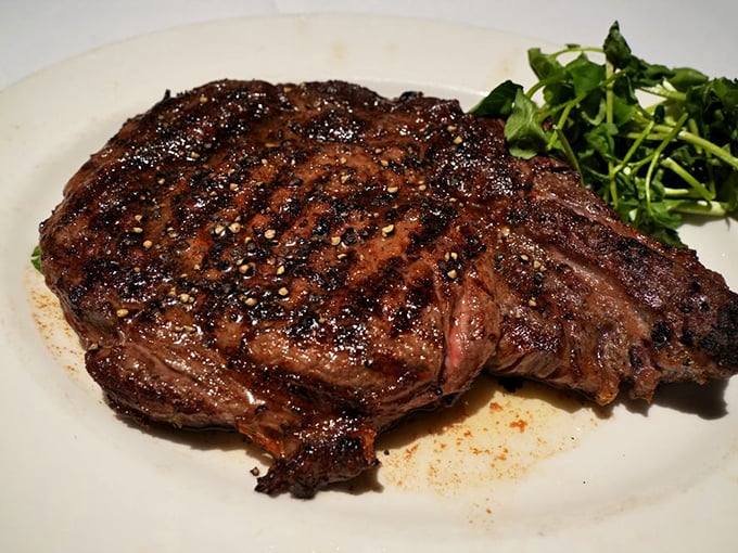 This glistening masterpiece doesn't just sit on the plate – it holds court, attended by wild mushrooms that have clearly pledged their allegiance.
