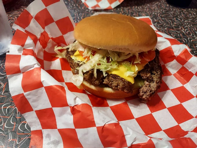 Behold the humble cheeseburger in its natural habitat. Notice how the melted cheese embraces the patty like it's been waiting all day for this reunion.