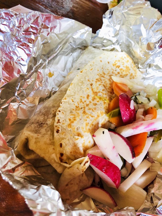 These street tacos aren't just food—they're edible art, with each lime wedge and cilantro sprig playing a crucial supporting role to the star proteins.